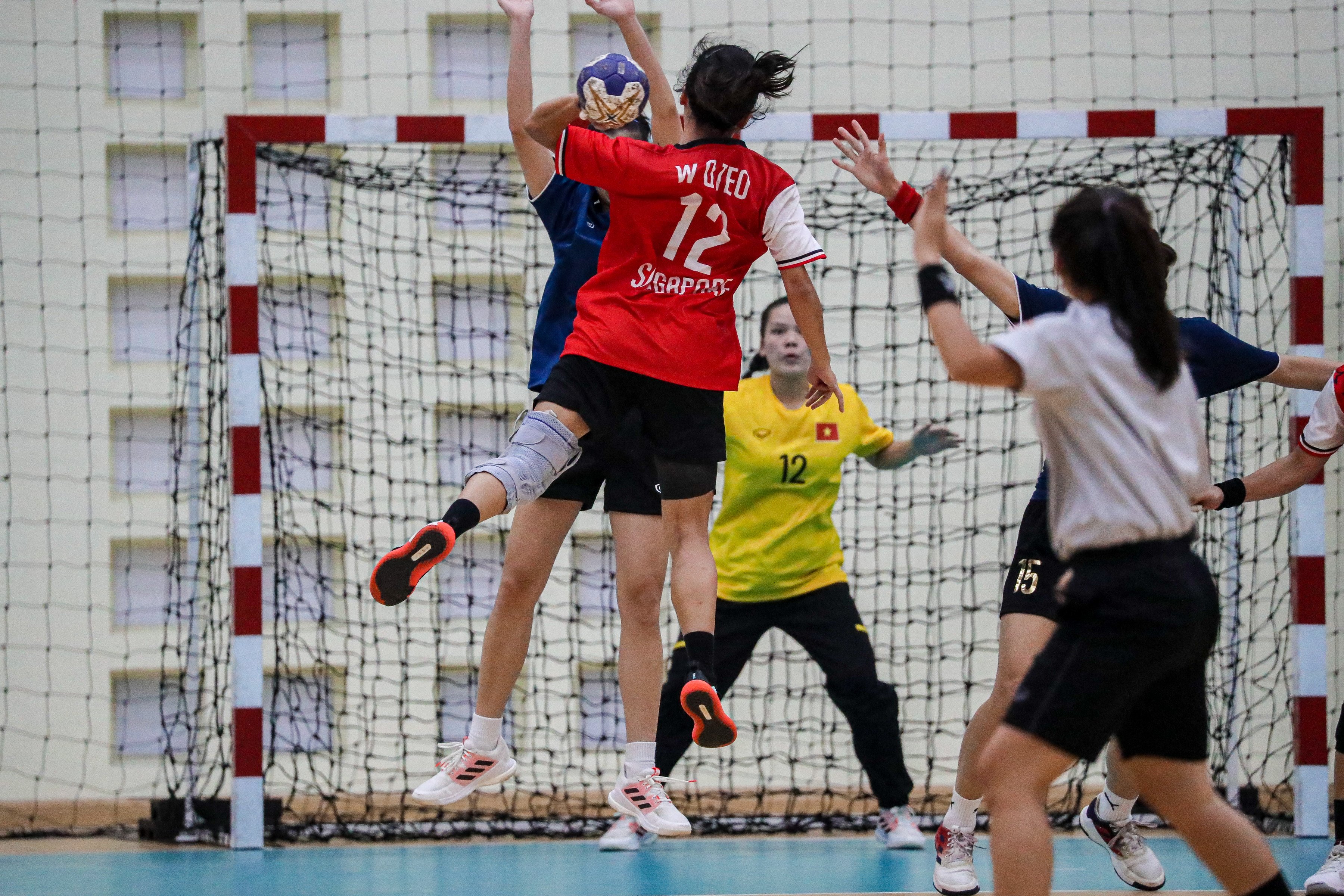 TeamSG's indoor handball teams miss out on medal chance at SEA Games debut!